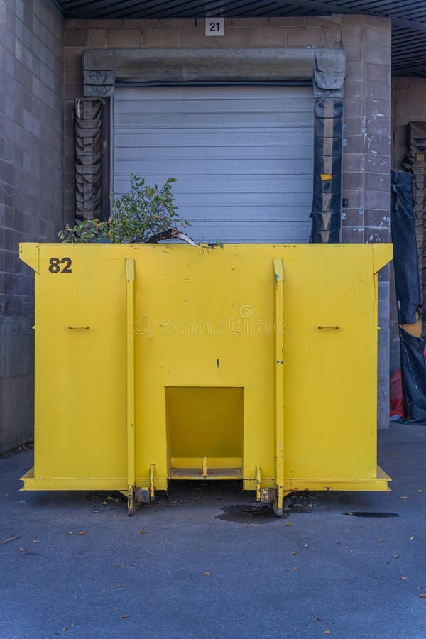 Yellow Garbage Collection Bin for Factory Stock Photo - Image of ...