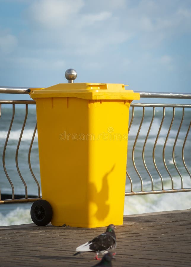 Yellow Garbage Container by the Sea . Stock Image - Image of recycling ...