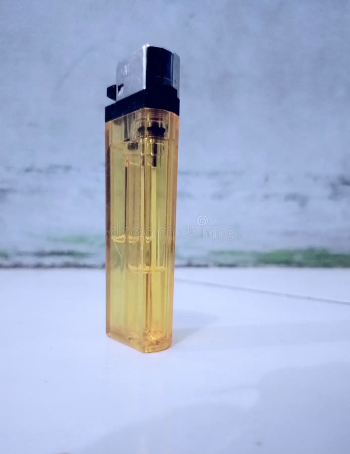 A Yellow Gas Lighter Stands on the Floor Stock Photo - Image of yellow ...