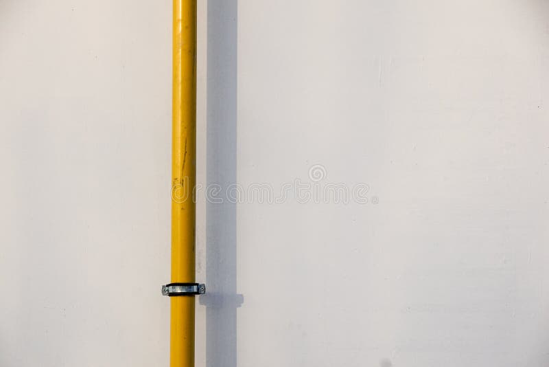 Yellow Gas Pipe in Front of Residential Building Wall Stock Photo ...
