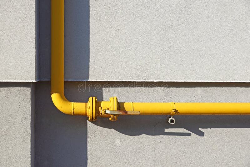 Yellow Gas Pipe in Front of Residential Building Wall Stock Photo ...