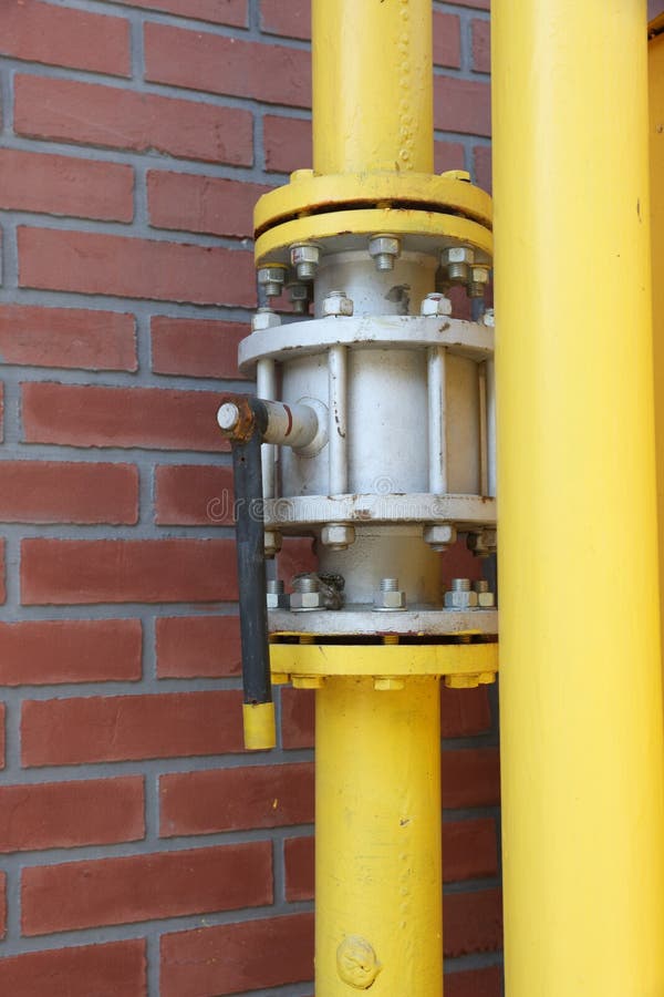 Yellow Gas Pipe Near Red Brick Wall Outdoors Stock Photo - Image of ...