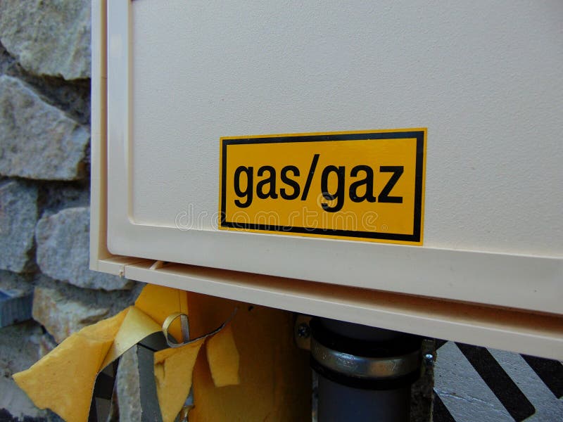 Yellow Gas Sign on White Box of House Stock Photo - Image of pipeline ...