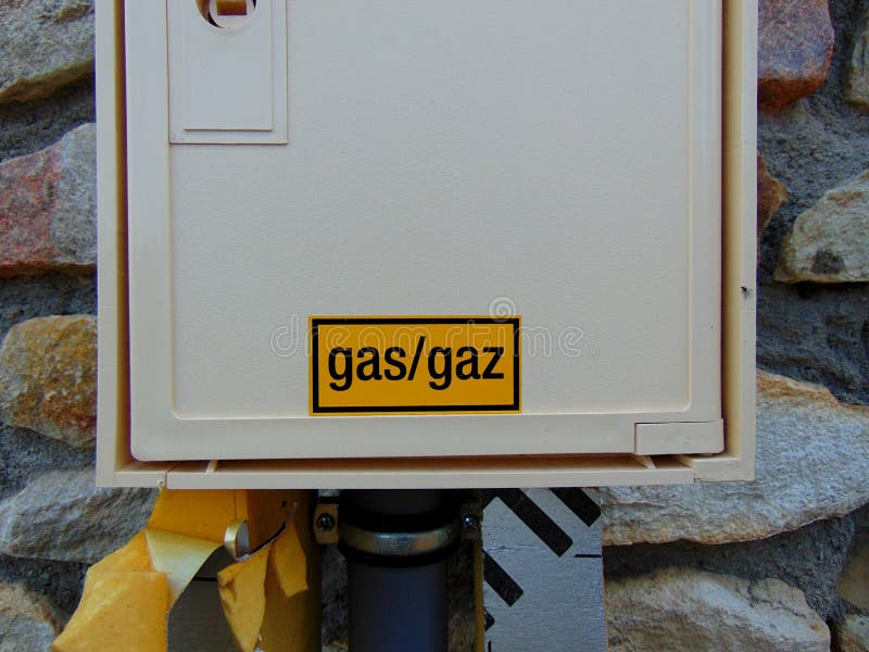 Yellow Gas Sign on White Box of House Stock Photo - Image of caution ...