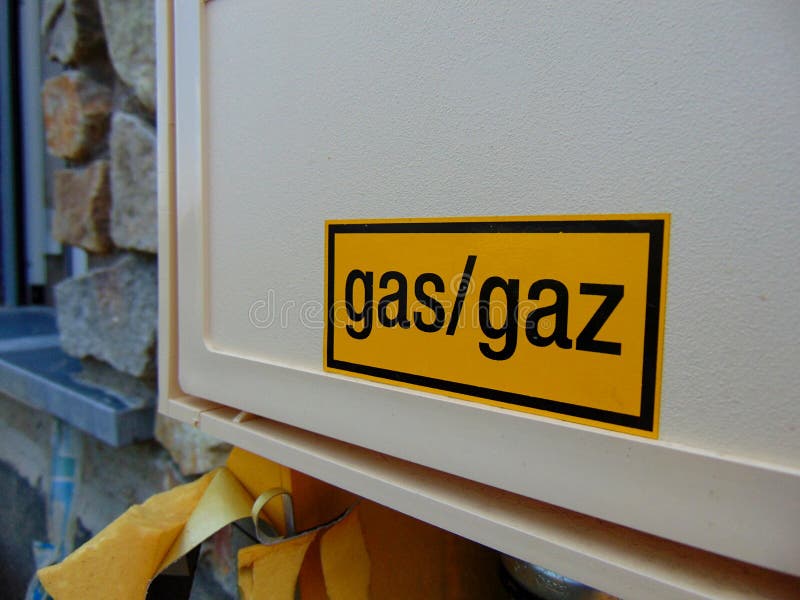 Yellow Gas Sign on White Box of House Stock Photo - Image of simple ...