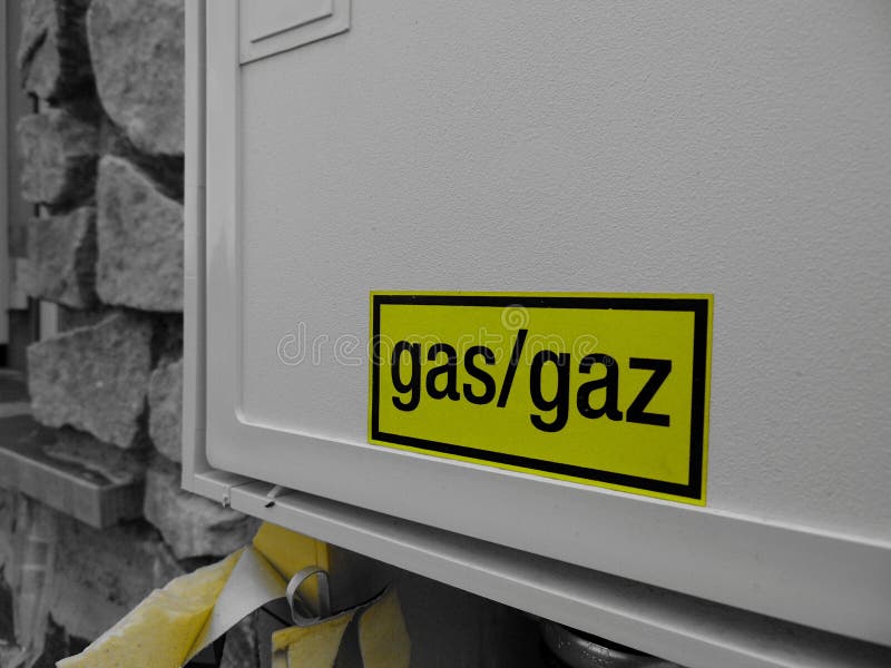 Yellow Gas Sign on White Box of House Stock Photo - Image of pipe ...