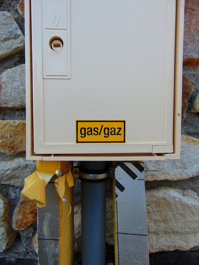 Yellow Gas Sign on White Box of House Stock Photo - Image of line ...