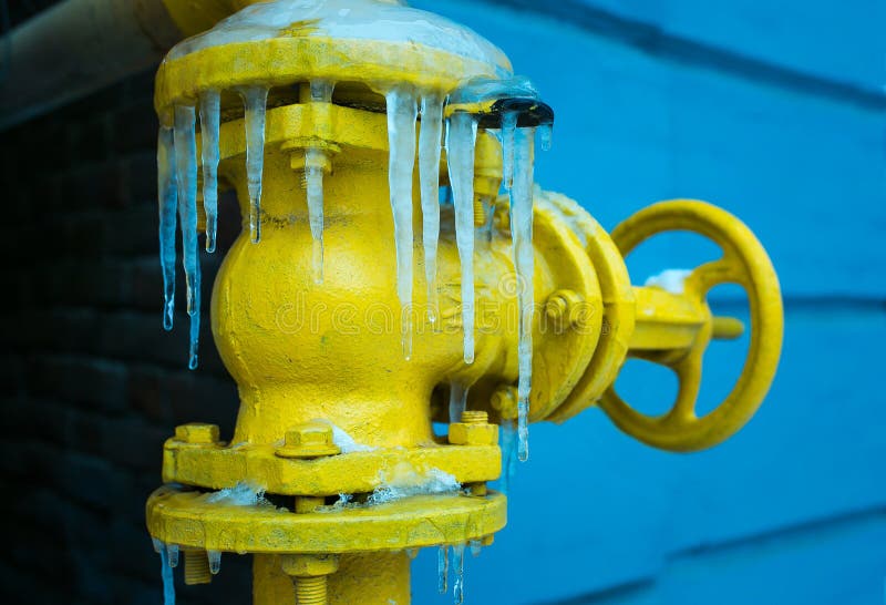 The Yellow Gas Valve is Covered with Ice and Icicles Stock Photo ...