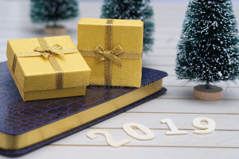 Yellow Gift Box with 2019 on Christmas Background Stock Image - Image ...