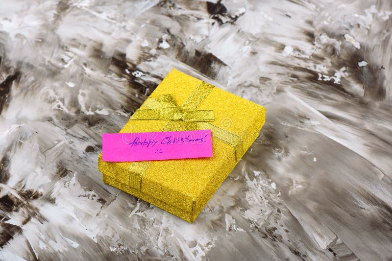 Yellow Gift Box with Handwritten Note Happy Christmas on Abstract ...