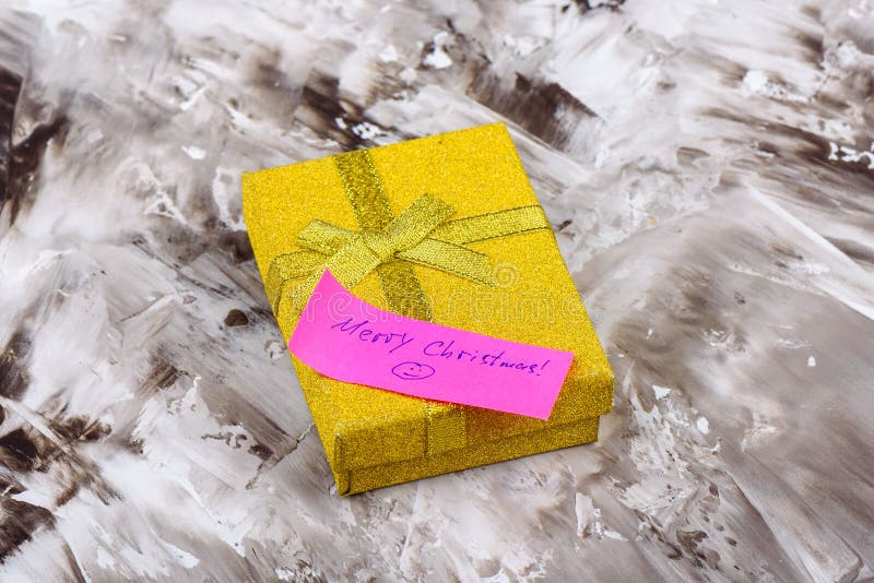 Yellow Gift Box with Handwritten Note Merry Christmas on Abstract ...