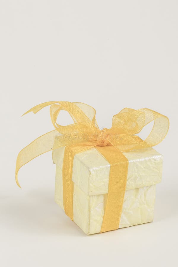Yellow gift box stock photo. Image of women, event, noel - 83249868