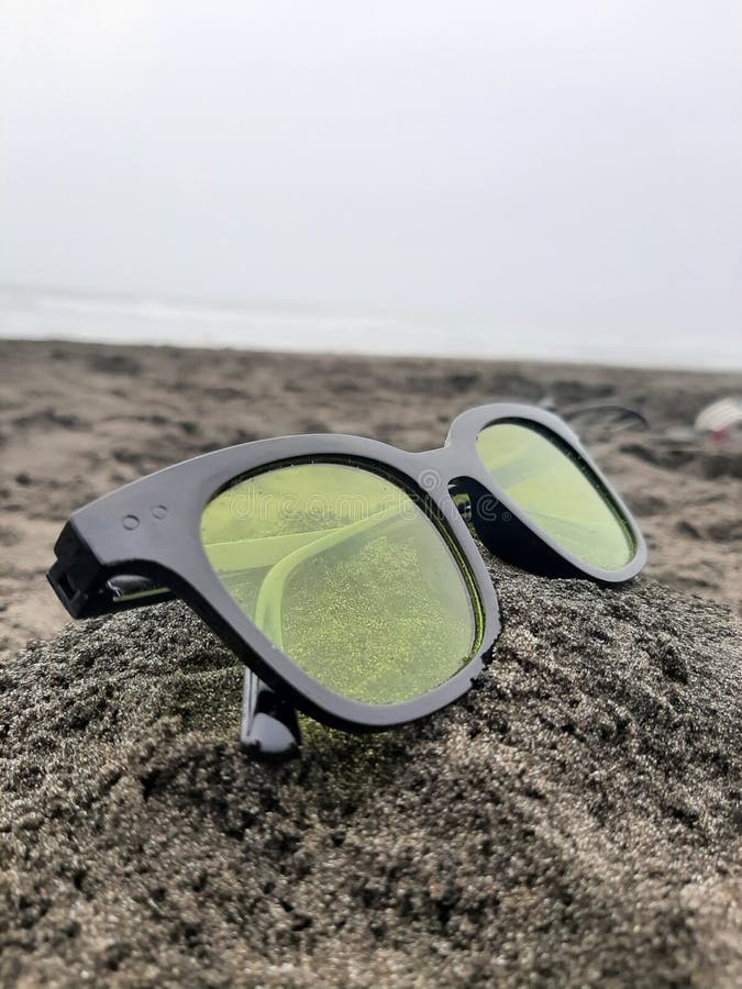 Yellow Glasses with Black Frames on the Beach Sand Stock Image - Image ...