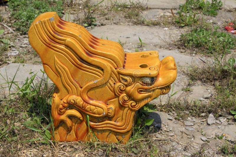 Yellow Glazed Tile Dragon Head in the Ground Stock Photo - Image of ...