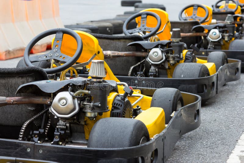 Yellow Go-kart in row stock photo. Image of hobby, perspective - 29554912