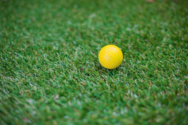 Yellow Golf Ball on Artificial Grass Turf Stock Image - Image of ...