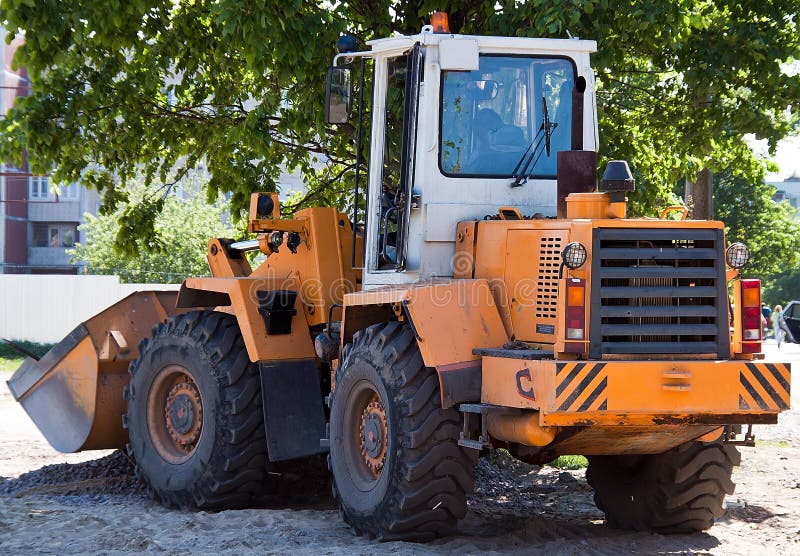 Yellow front end loader stock image. Image of loader, pivot - 936377