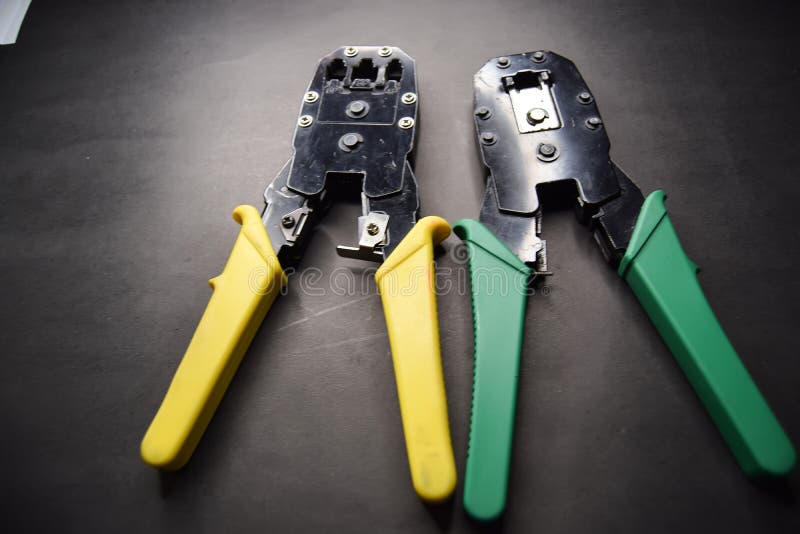 Yellow and Green Adjustable Wire Stripper Isolated on a Black ...