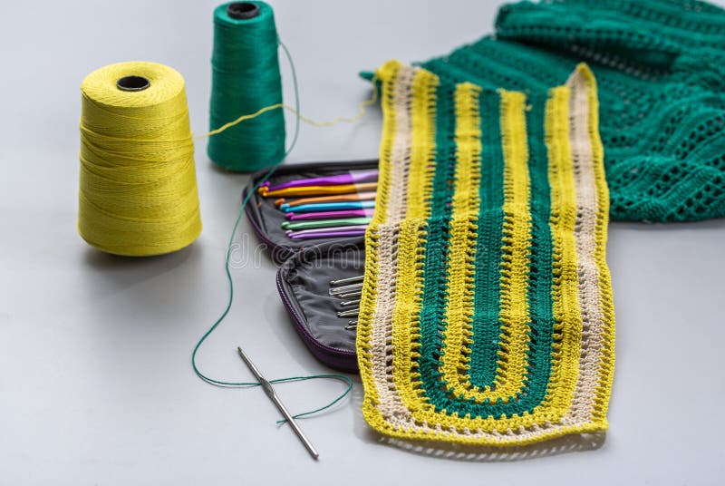 Yellow and Green Crocheting Pattern with Crochet Hook Close-up Stock ...