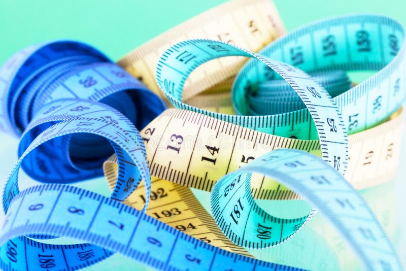 Yellow, Green and Dark Blue Measuring Tapes Stock Photo - Image of ...