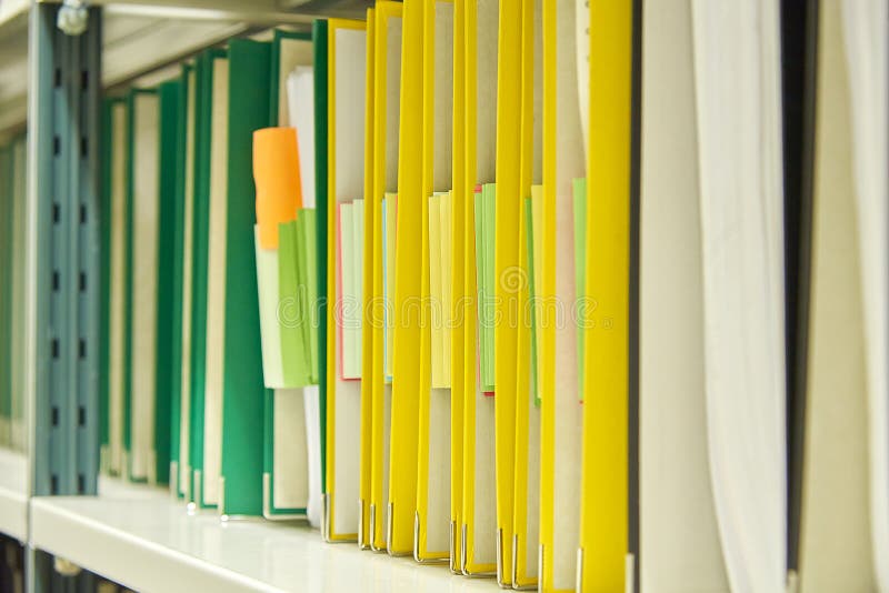 Yellow and Green File Folders in Archive. Stock Photo - Image of ...