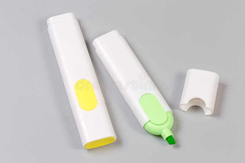 Yellow and Green Highlighter Pens on a Gray Background Stock Image ...