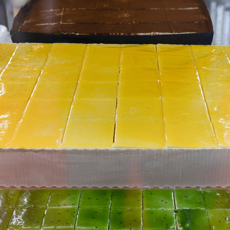 Yellow and Green Rectangular Cakes Cut into Square Slices and Displayed ...