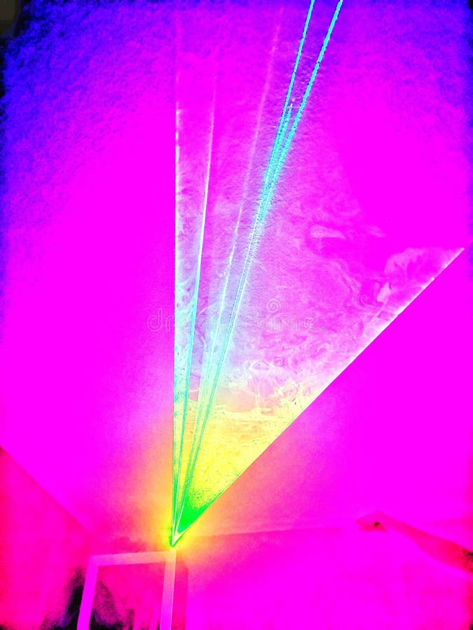 Yellow and Green Sharp Laser Light with Pink Wall Background Stock ...