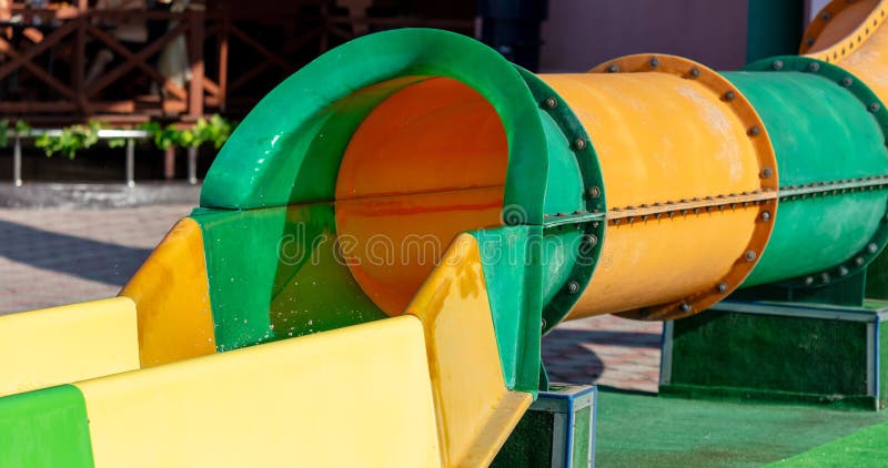 Yellow-green Slide in the Pool of the Water Park Stock Image - Image of ...