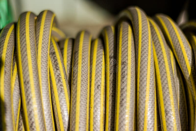 Yellow grey water hose stock photo. Image of yellow - 113169980