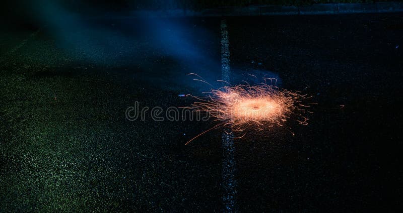 Yellow Ground Fireworks on Asphalt.. Stock Image - Image of long ...