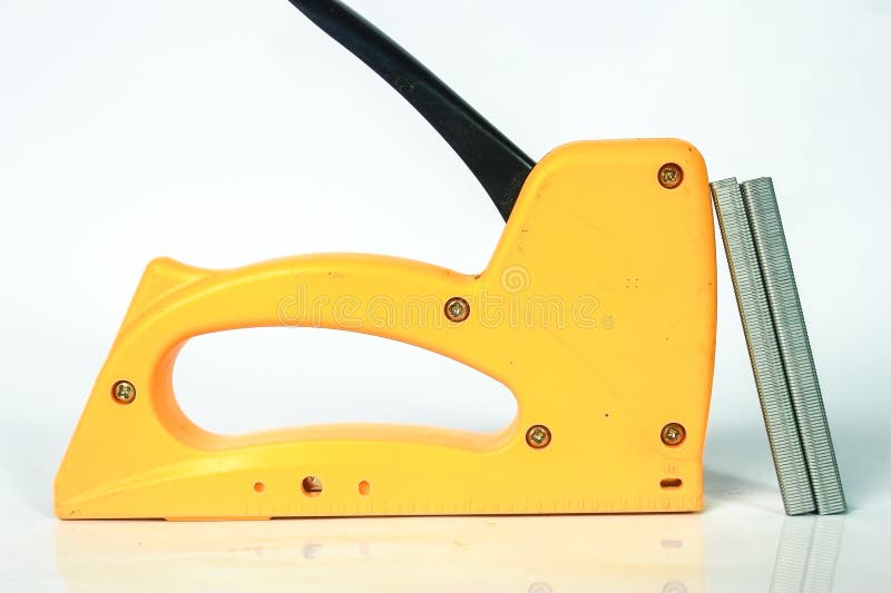Yellow Gun Tacker with Staples, on White Background and Reflection ...
