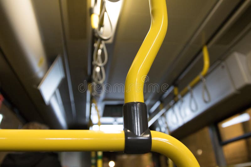 Yellow Handles Inside a Bus Stock Image - Image of closeup, tight ...