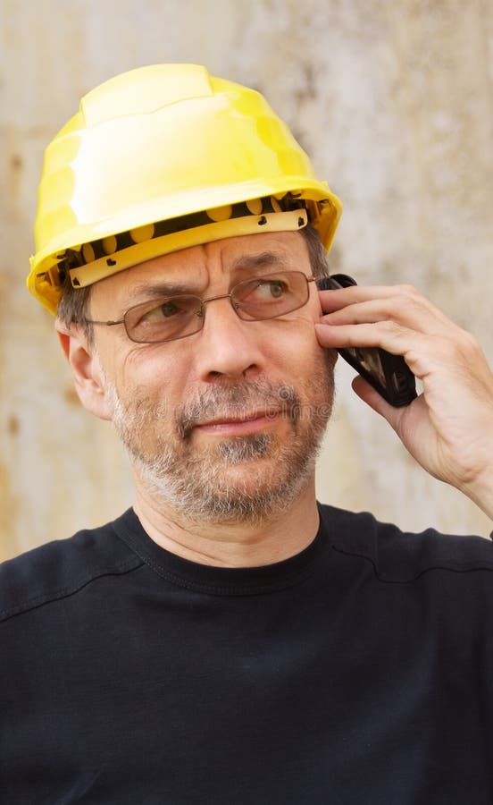 Yellow hard hat stock image. Image of person, mobile, stare - 6326239