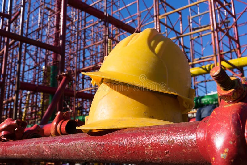 Yellow Hardhat on Construction Site Stock Image - Image of hardhat ...