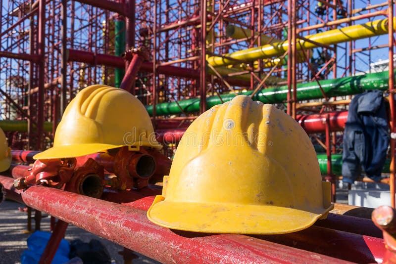 Yellow Hardhat on Construction Site Stock Image - Image of protection ...