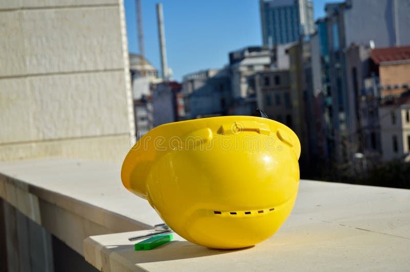 Yellow Hardhat on Construction Site Stock Photo - Image of bright ...