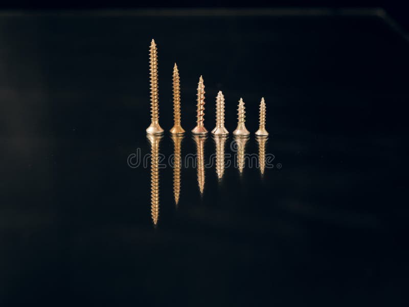 Yellow Hardware Screws on a White Background Stock Photo - Image of ...