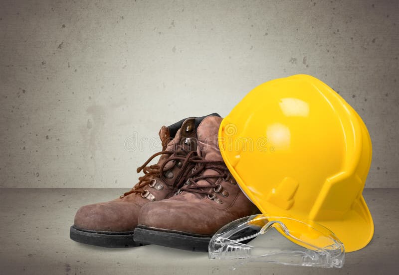 Yellow Working Hard Hat and Work Boots on Wooden Stock Image - Image of ...