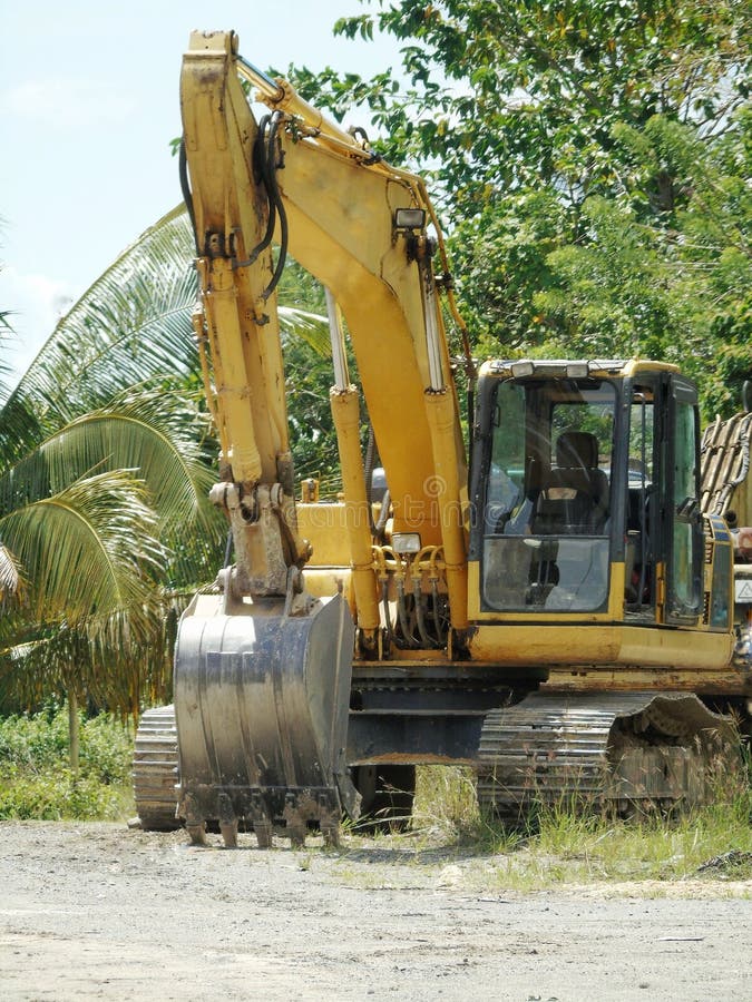A Yellow Heavy Equipment Unit is Parked Stock Image - Image of heavy ...