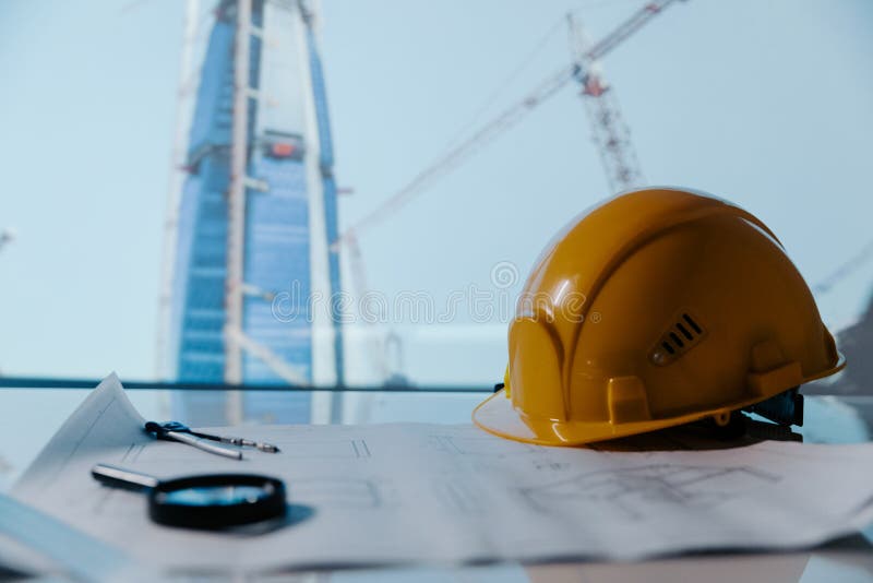 Yellow Helmet Hat in the Project at Construction Site Building on a ...