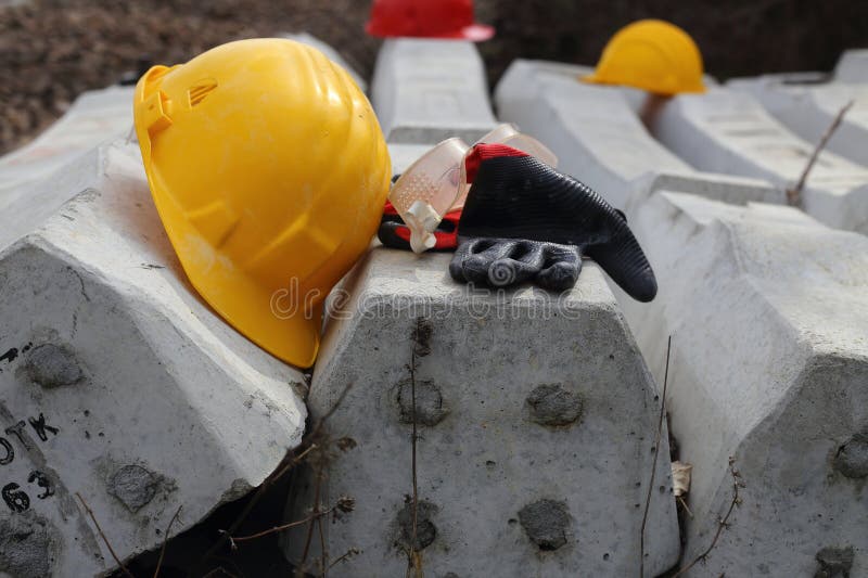 Yellow Helmet on a Work Site Stock Photo - Image of worker, yellow ...