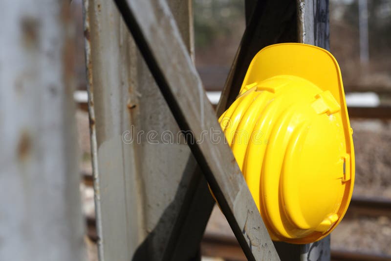 Yellow Helmet on a Work Site Stock Image - Image of background ...