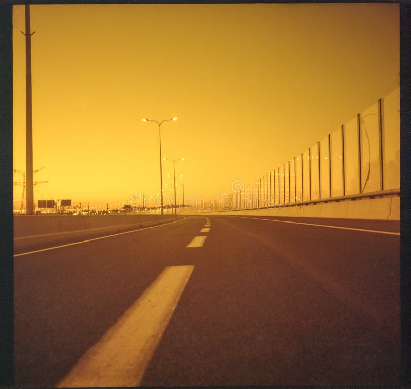 Yellow Highway at sunset stock image. Image of dazzle - 87302533
