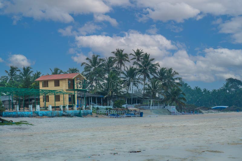 Yellow House on a Sandy Beach, Surrounded by Palm Trees Stock Photo ...