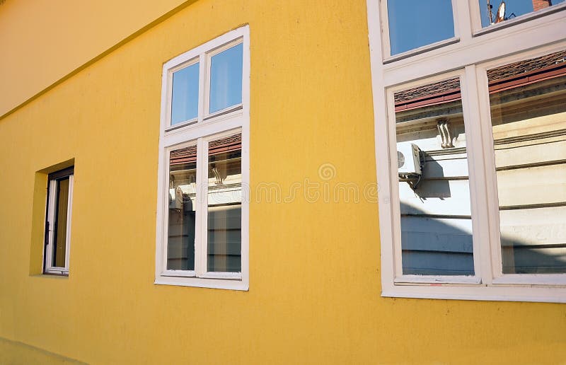 Yellow house with windows stock photo. Image of architecture - 50467614