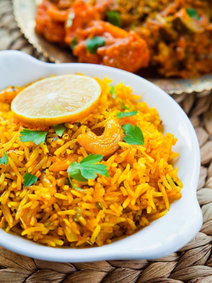 Yellow Indian Rice with Lemon Stock Photo - Image of juice, pudding ...