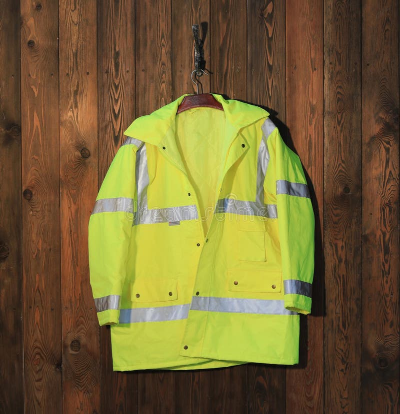 Yellow Industrial Jacket on Hanger Stock Image - Image of protective ...