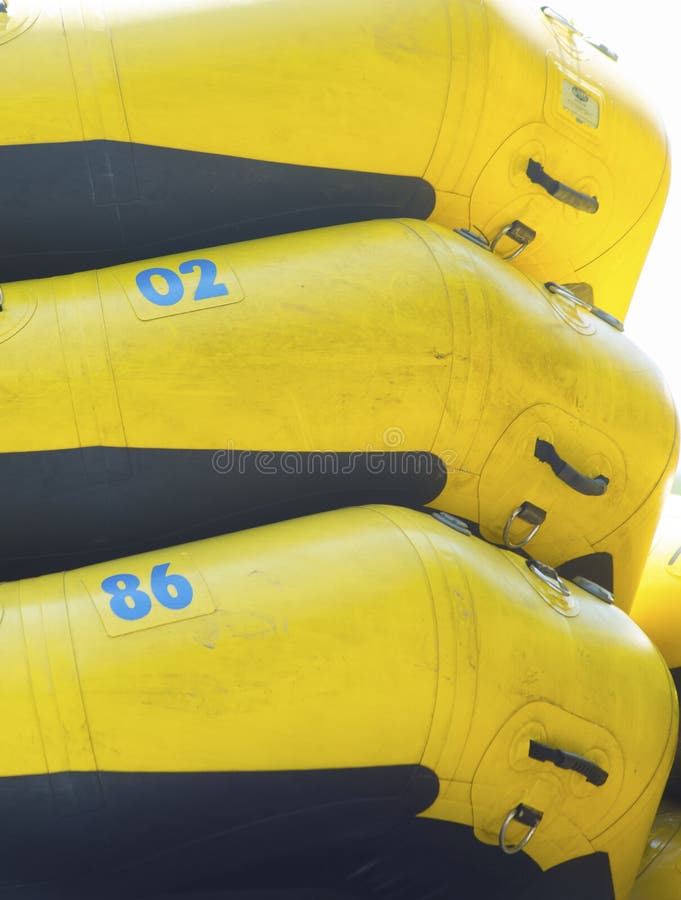 Yellow Inflatable Boats Stacked on Top of Each Other. Stock Photo ...