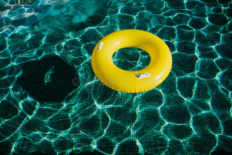 Yellow Inflatable Donuts Floating in a Swimming Pool. Nobody Stock ...